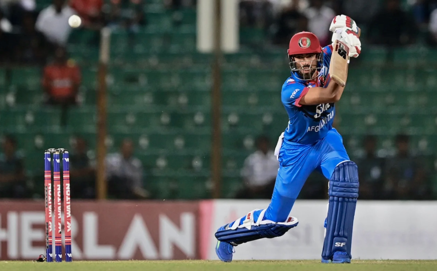 Afghanistan win rain-hit opener